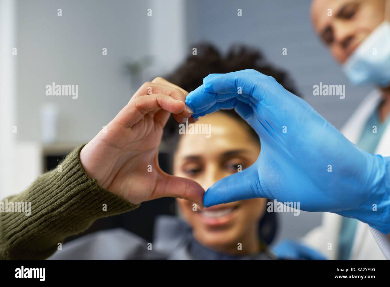 Doctor and Patient Forming a Heart Shape With Hands Signifying Care and ...