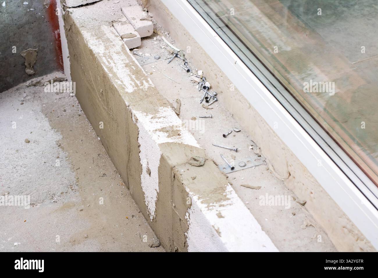 A window sill featuring a combination of concrete and styrofoam ...