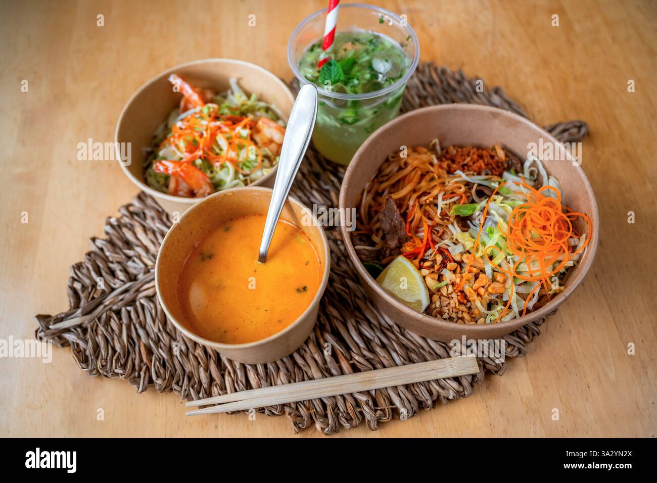 Asian menu with spicy coconut soup, pad thai, vegetable salade with ...