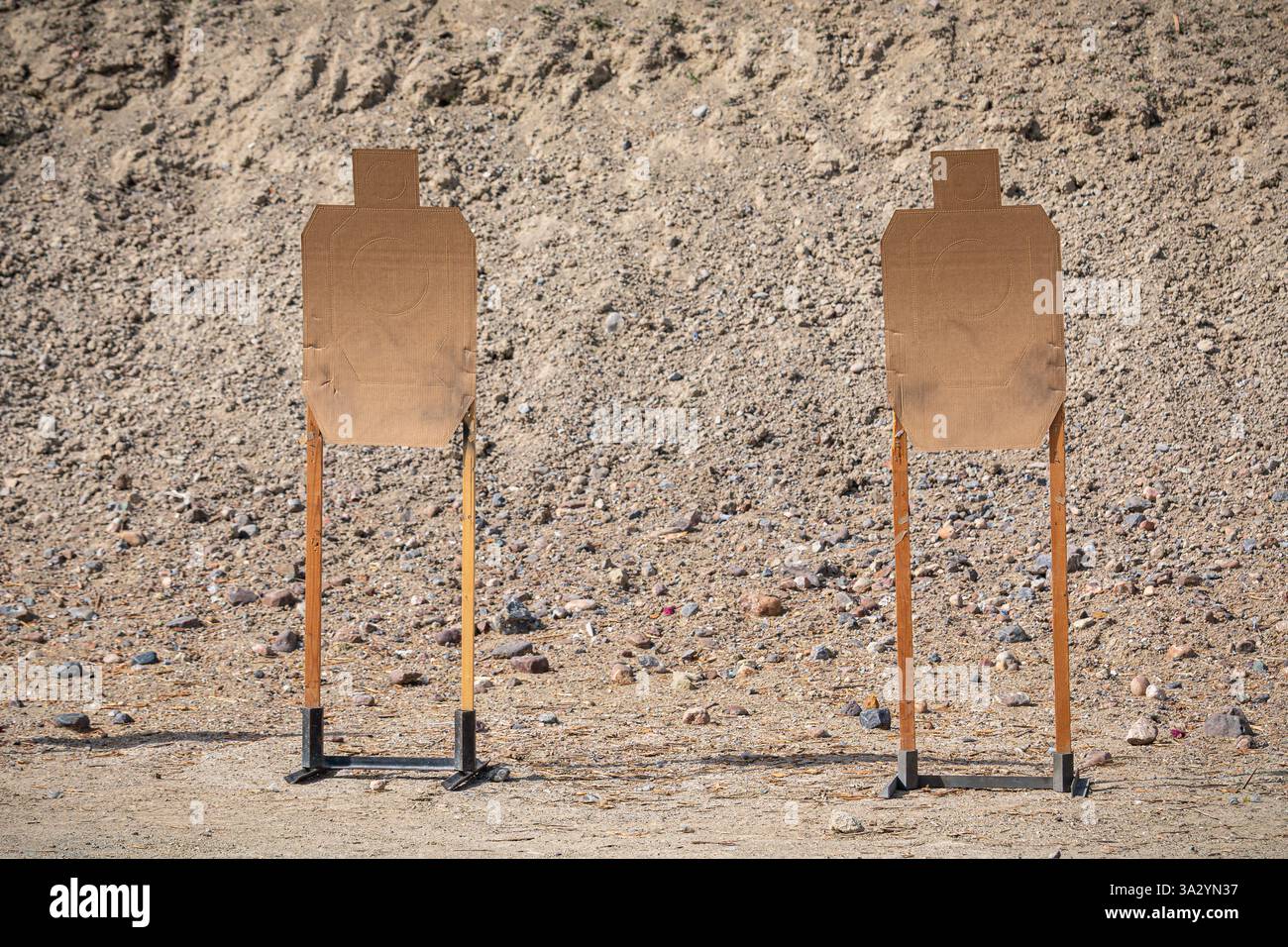 Pair of clean cardboard silhouette targets with black gun-shaped ...