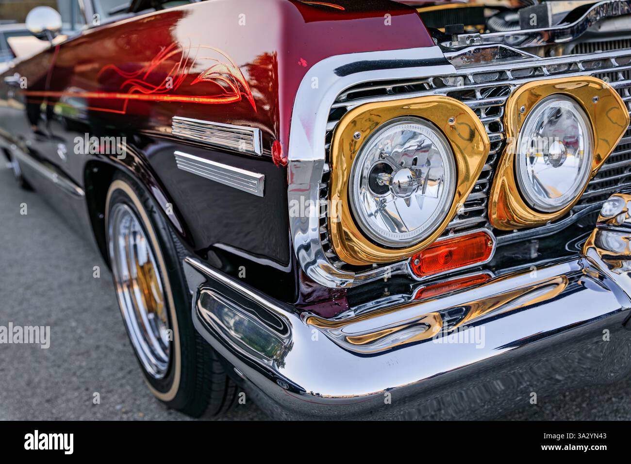 San Bruno, USA - October 7, 2022: Headlights of a burgundy Chevrolet ...