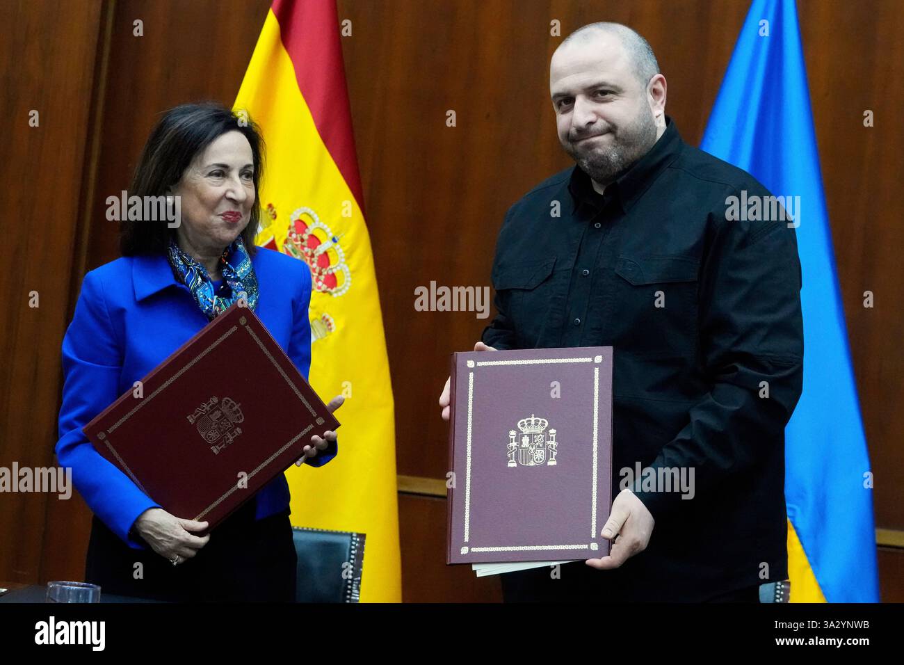 Ukrainian Minister of Defense Rustem Umerov, right, poses with Spain's Defense Minister ...