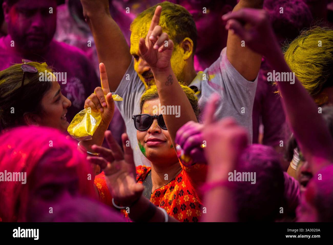 Indians dance as they celebrate Holi in Guwahati, India, Friday, March 14, 2025. (AP Photo ...