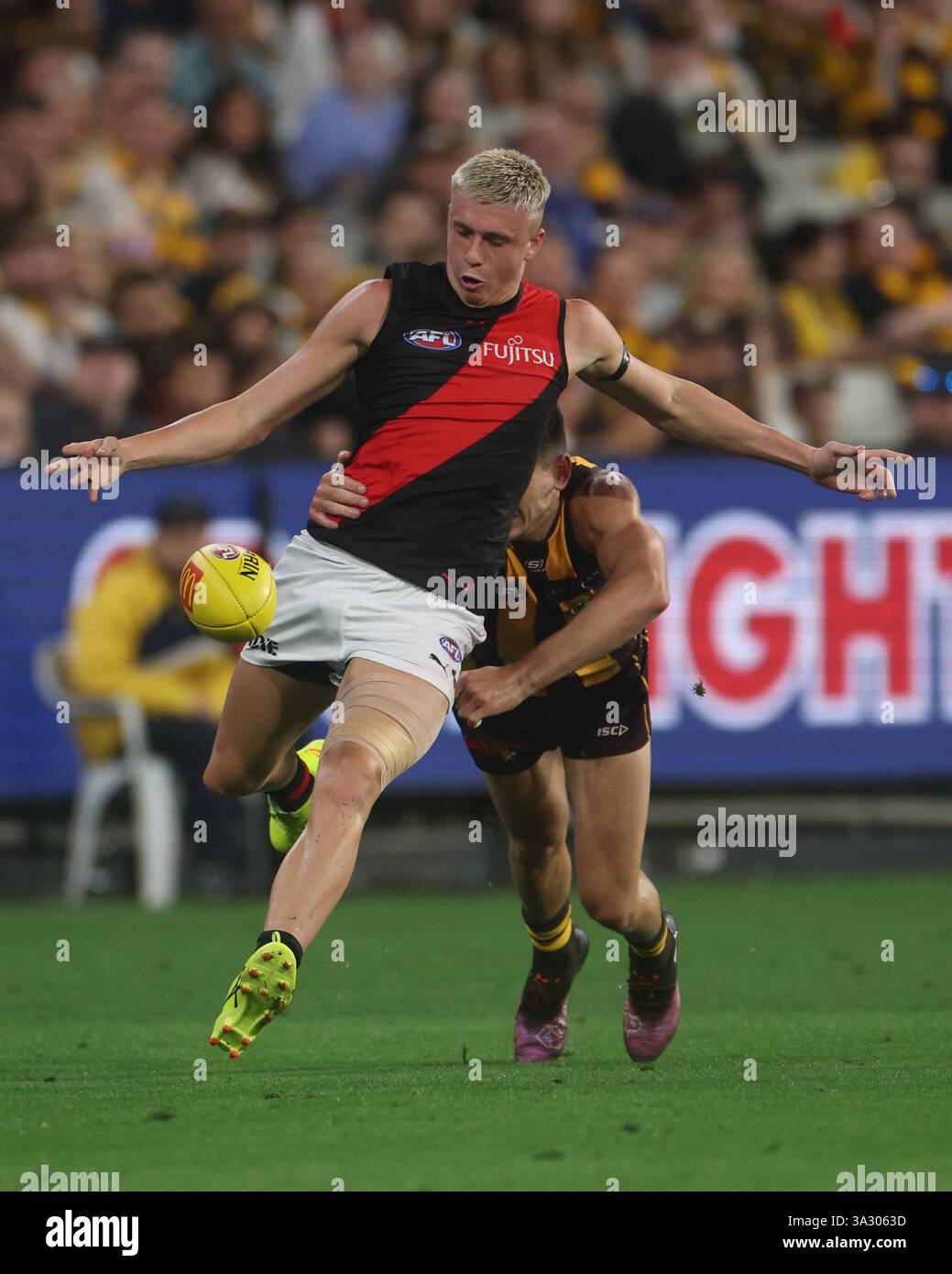 Melbourne, Australia. 14th Mar, 2025. Nate Caddy of the Bombers kicks ...