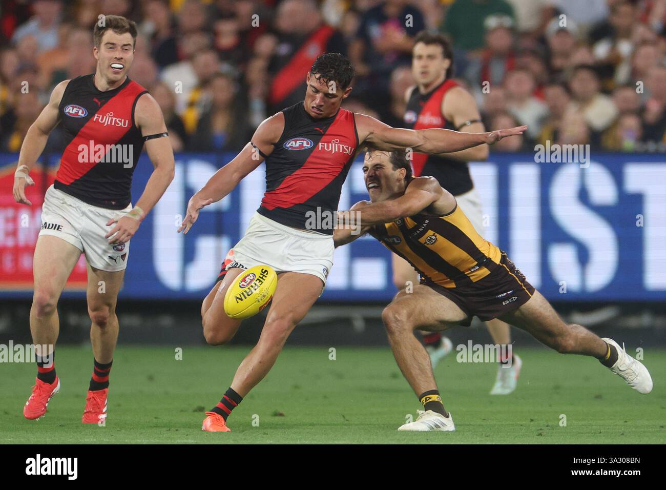 Jye Caldwell of the Bombers kicks the ball during the AFL Round 1 match ...