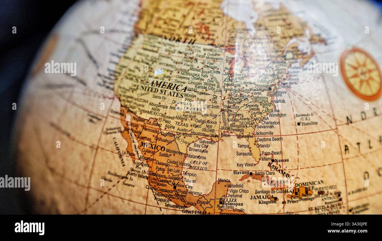 Table world Globe model in blue and brown color isolated on black ...