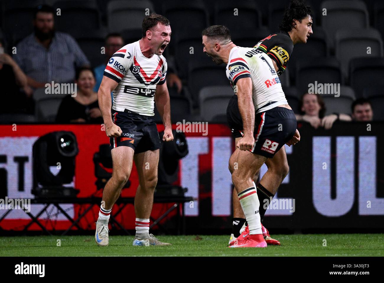 Sydney, Australia. 14th Mar, 2025. Sandon Smith of the Roosters (left ...