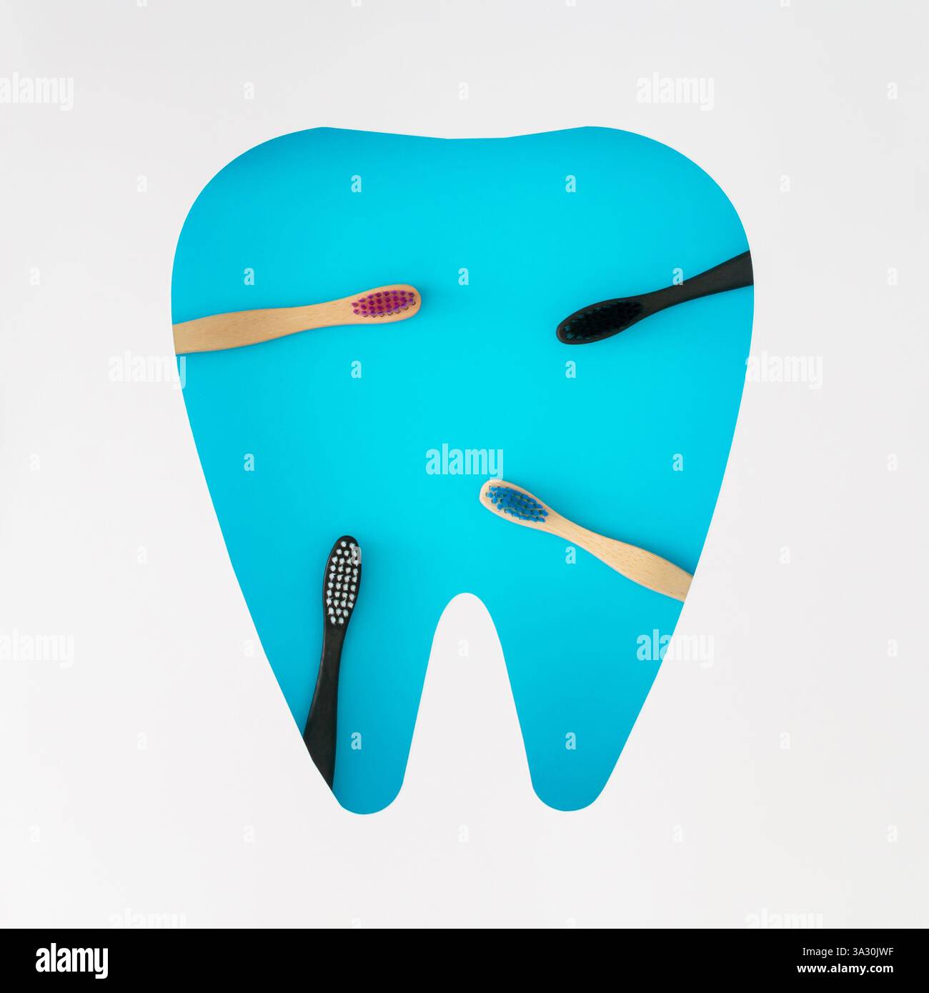 Organic bamboo toothbrush pattern on blue background visible through a ...