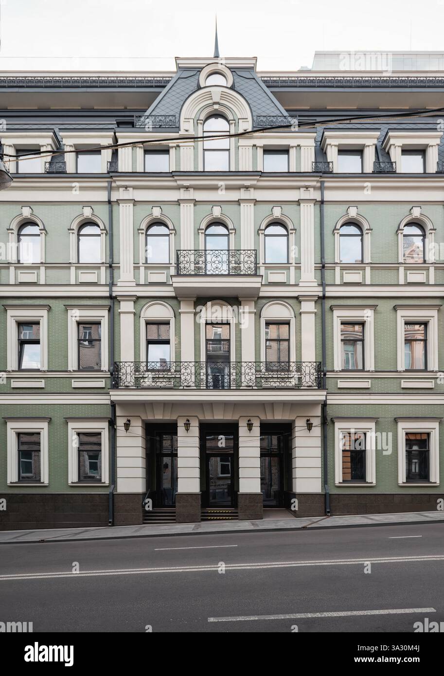 Facade of a classic style building with beige window surrounds ...