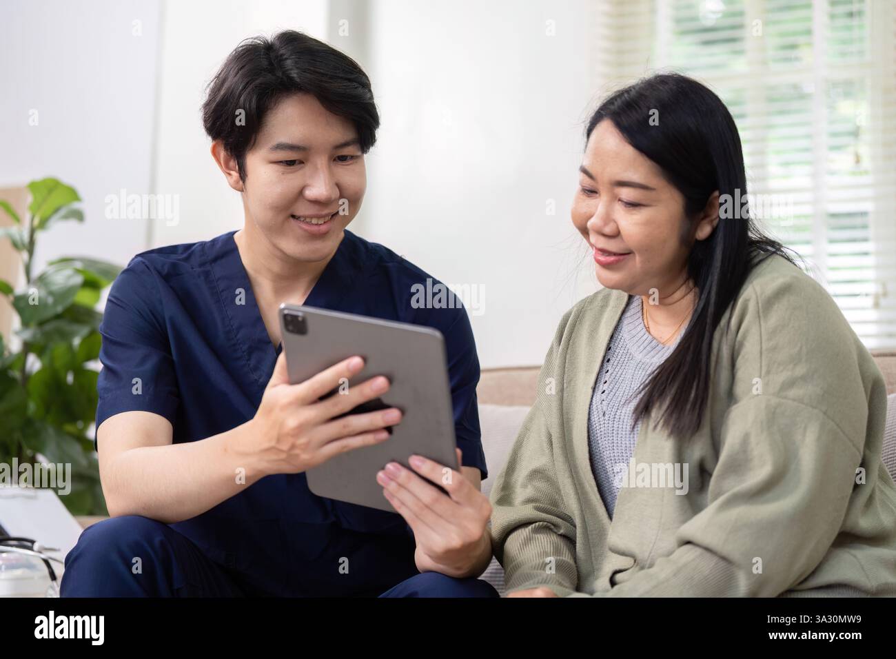 Healthcare and Technology Use. A healthcare professional demonstrates ...