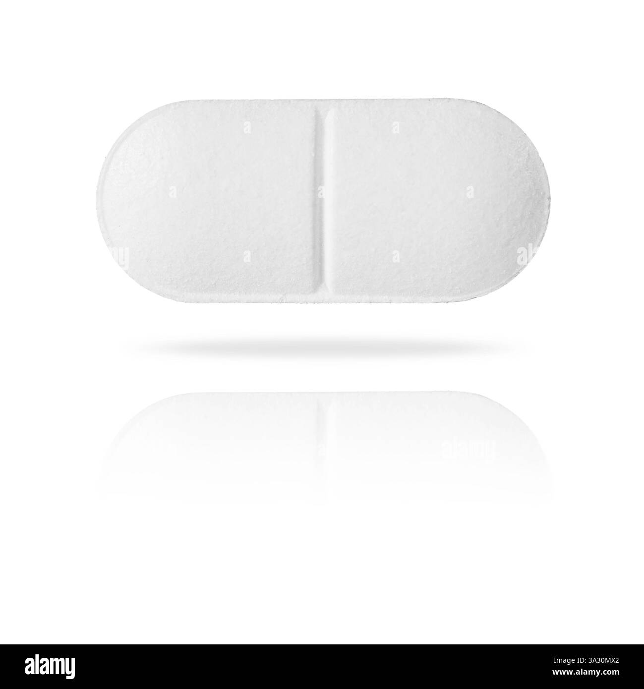 A white oblong tablet with a visible score line is placed on a ...