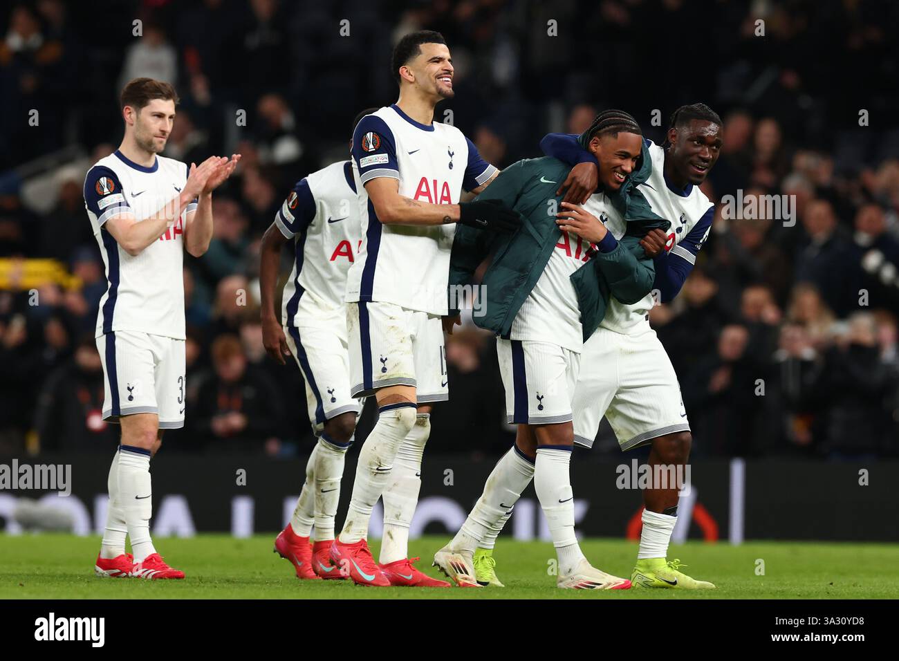 Wilson Odobert of Tottenham Hotspur celebrates the 3-1 win with Yves ...