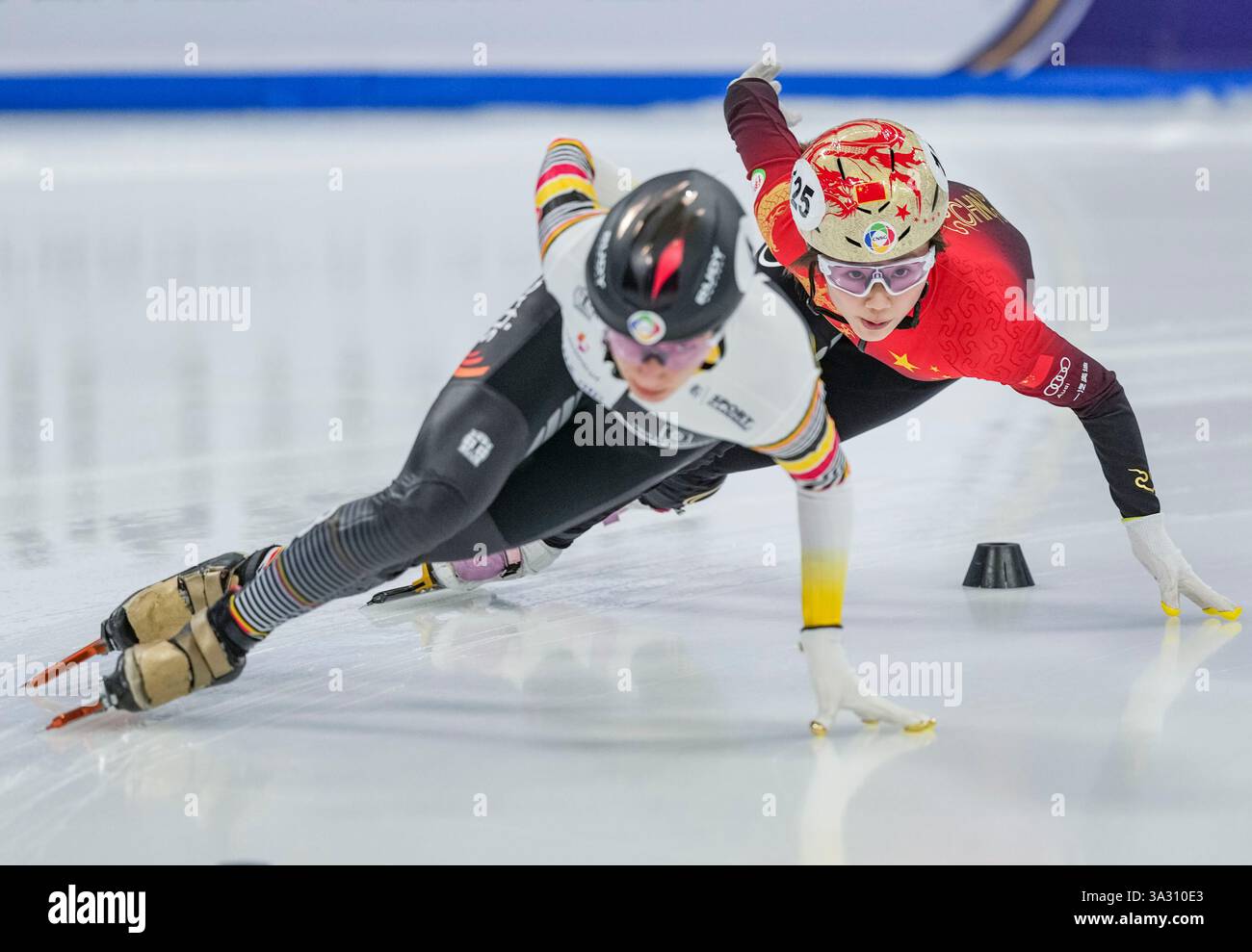 Beijing, China. 14th Mar, 2025. Yang Jingru (R) of China competes ...
