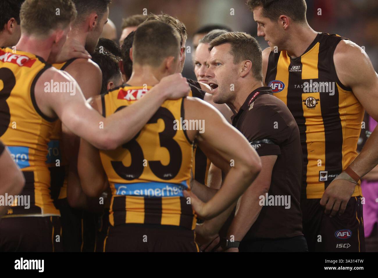 Sam Mitchell, Senior Coach of the Hawks speaks to the team during the ...