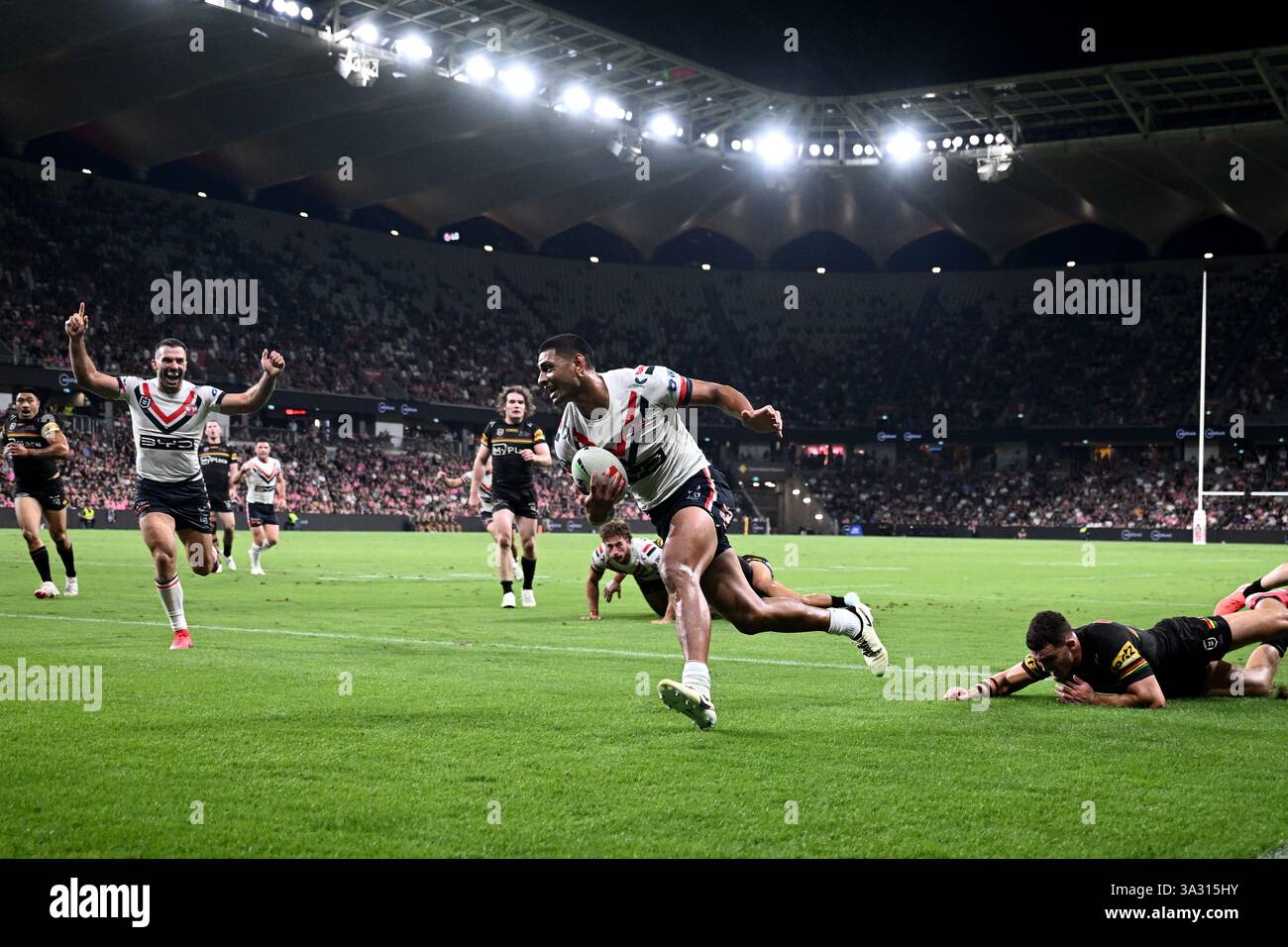 Sydney, Australia. 14th Mar, 2025. Daniel Tupou of the Roosters scores ...