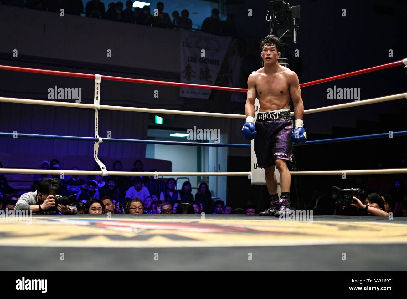 Challenger Mikyo Watarai waits in the neutral corner after knocking ...