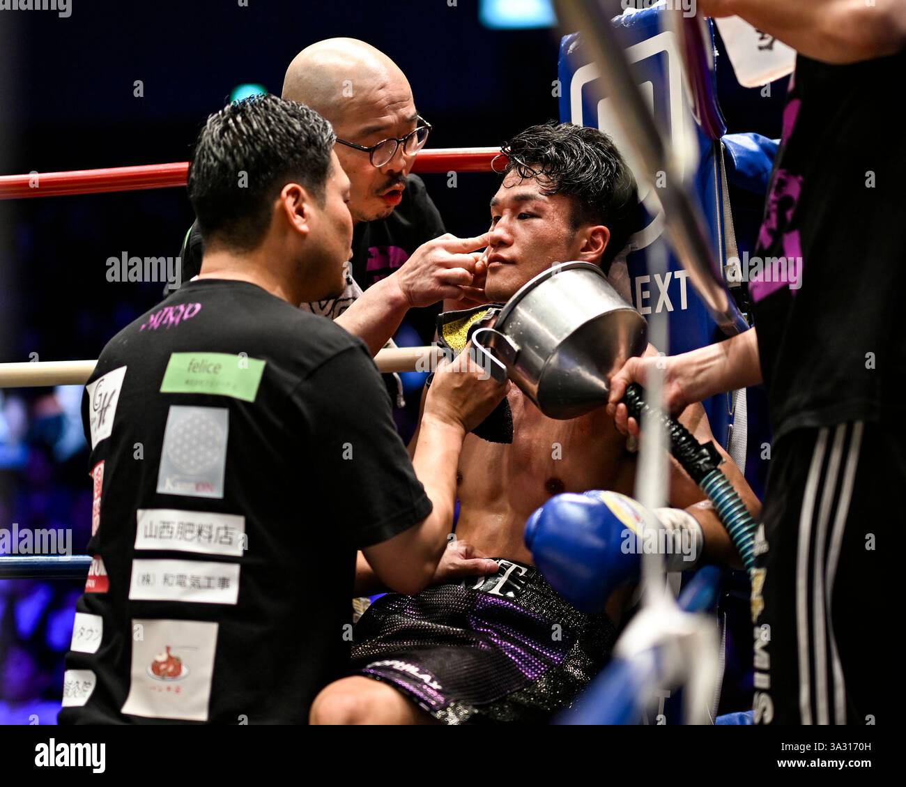Challenger Mikyo Watarai receives treatment before the eighth round ...