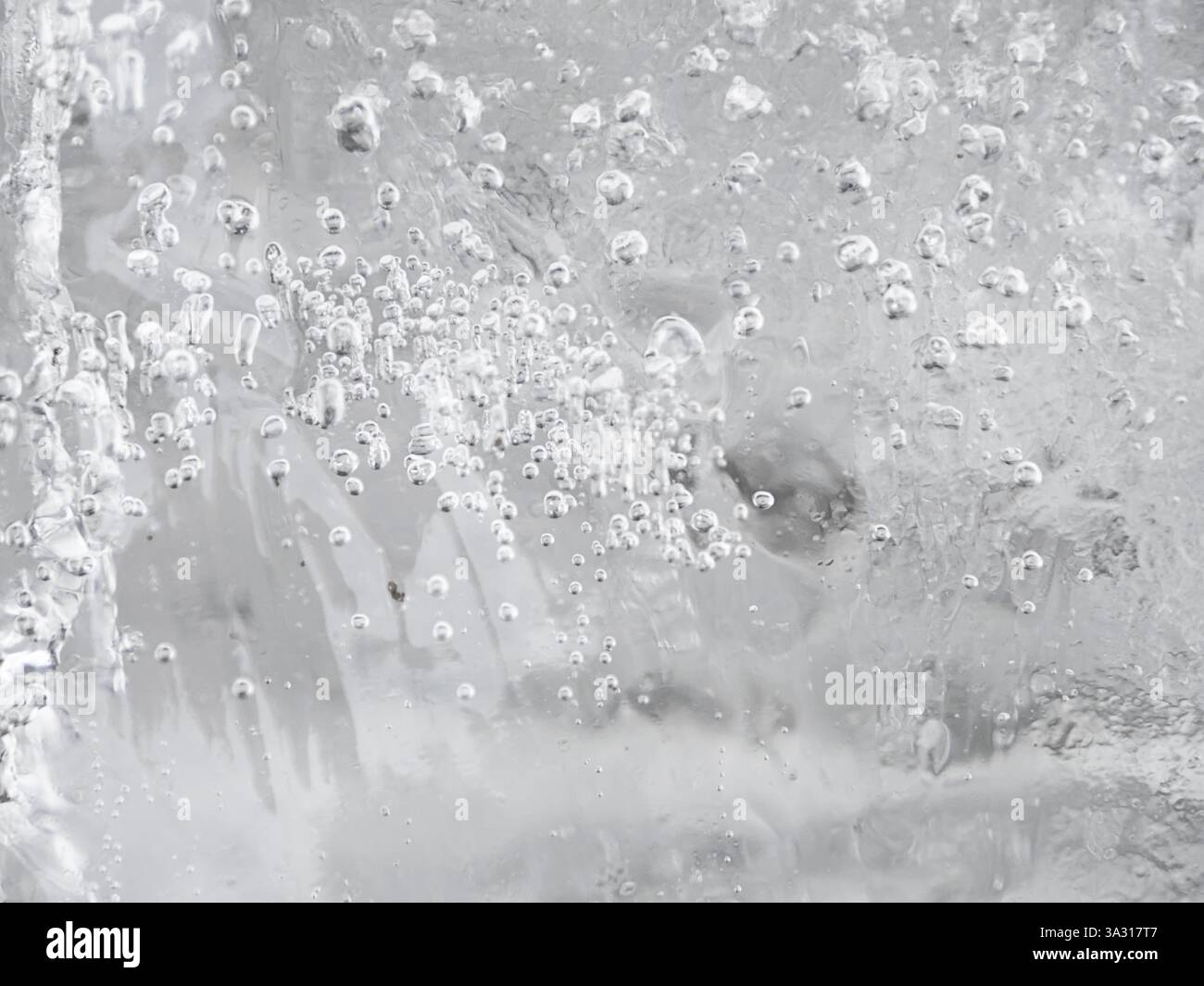 Ice texture of frozen air bubbles floating up, close up Stock Photo - Alamy