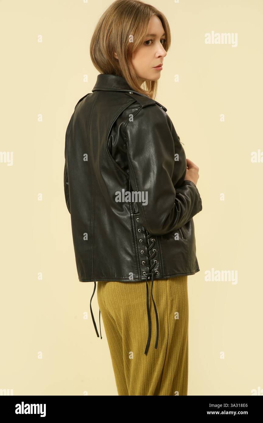 Studio photos of female model wearing basic comfortable knitted oregano green set with biker ...