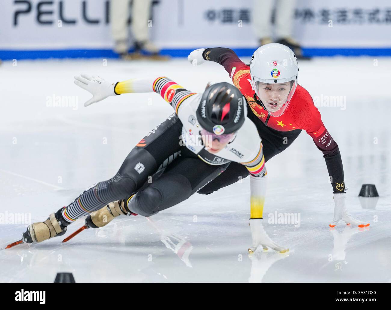 Beijing, China. 14th Mar, 2025. Wang Xinran (R) of China competes ...