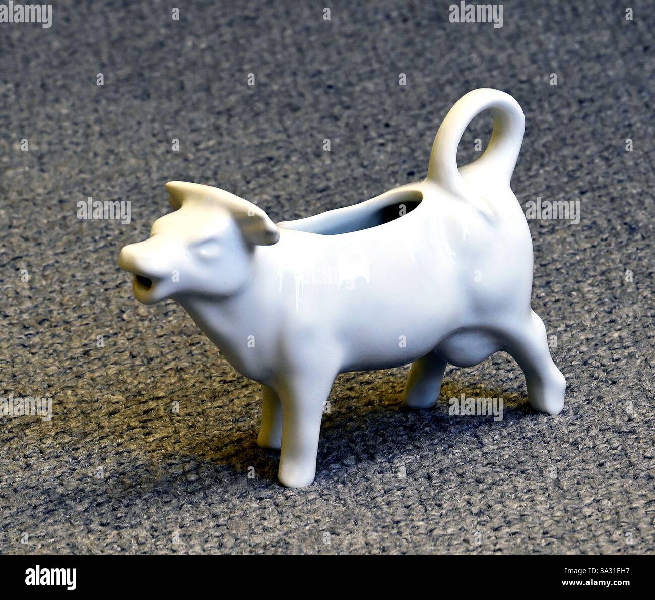 White ceramic cow creamer milk jug Stock Photo - Alamy