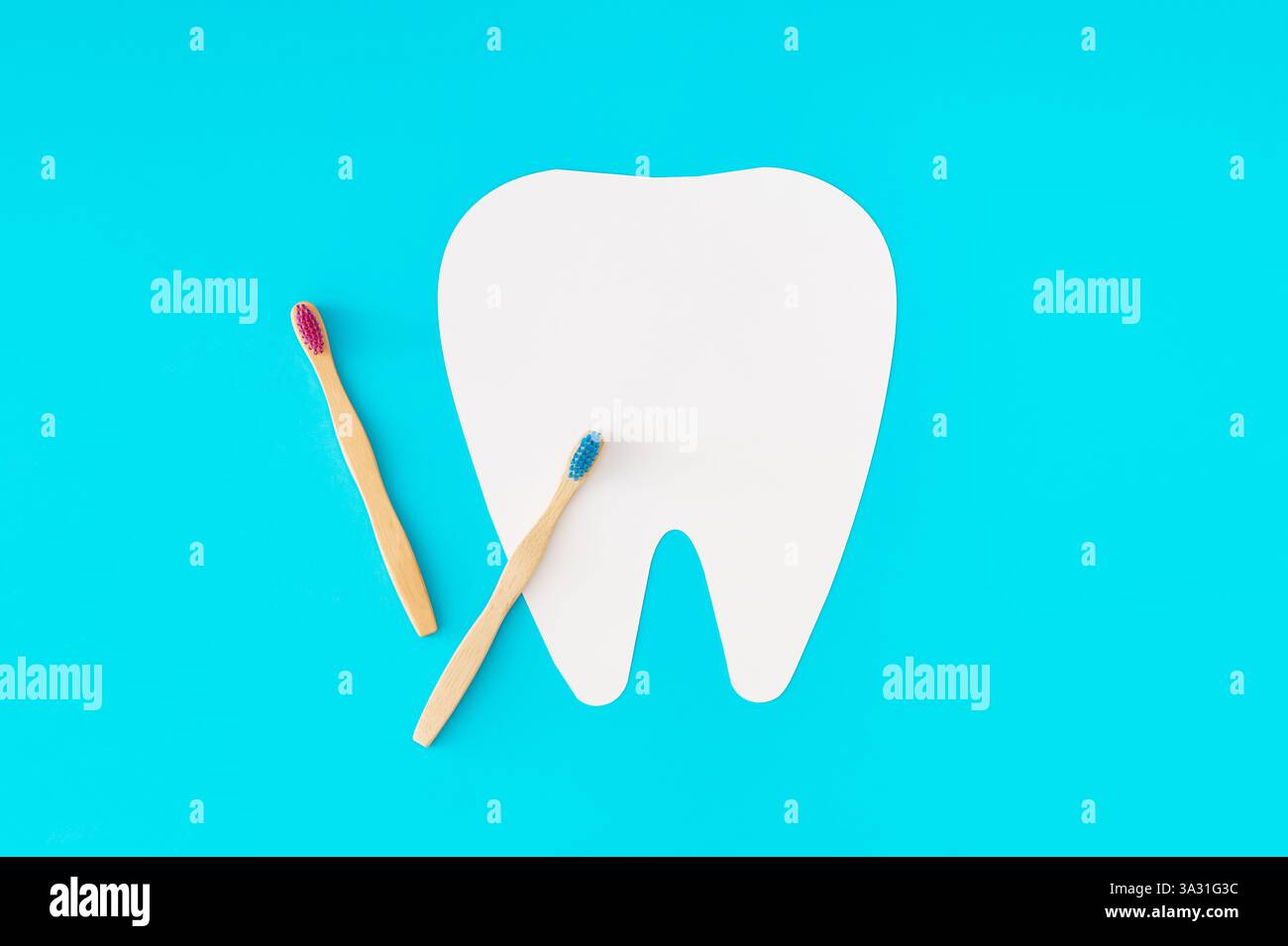 Creative layout with organic bamboo toothbrushes and white tooth shaped ...