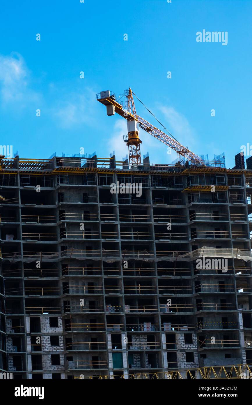 A dynamic construction site featuring multiple cranes and a significant ...