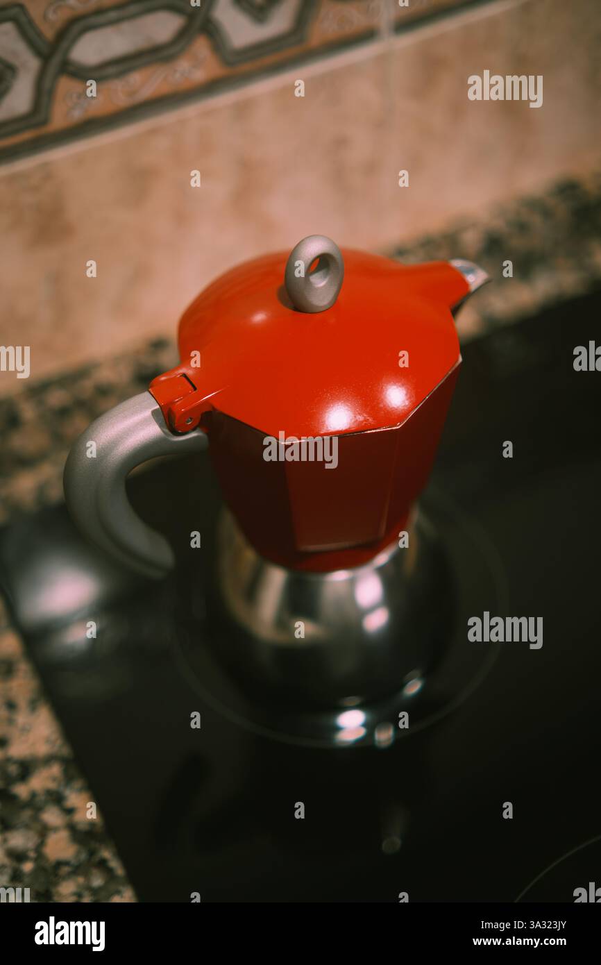Brewing red moka coffee at home Stock Photo - Alamy