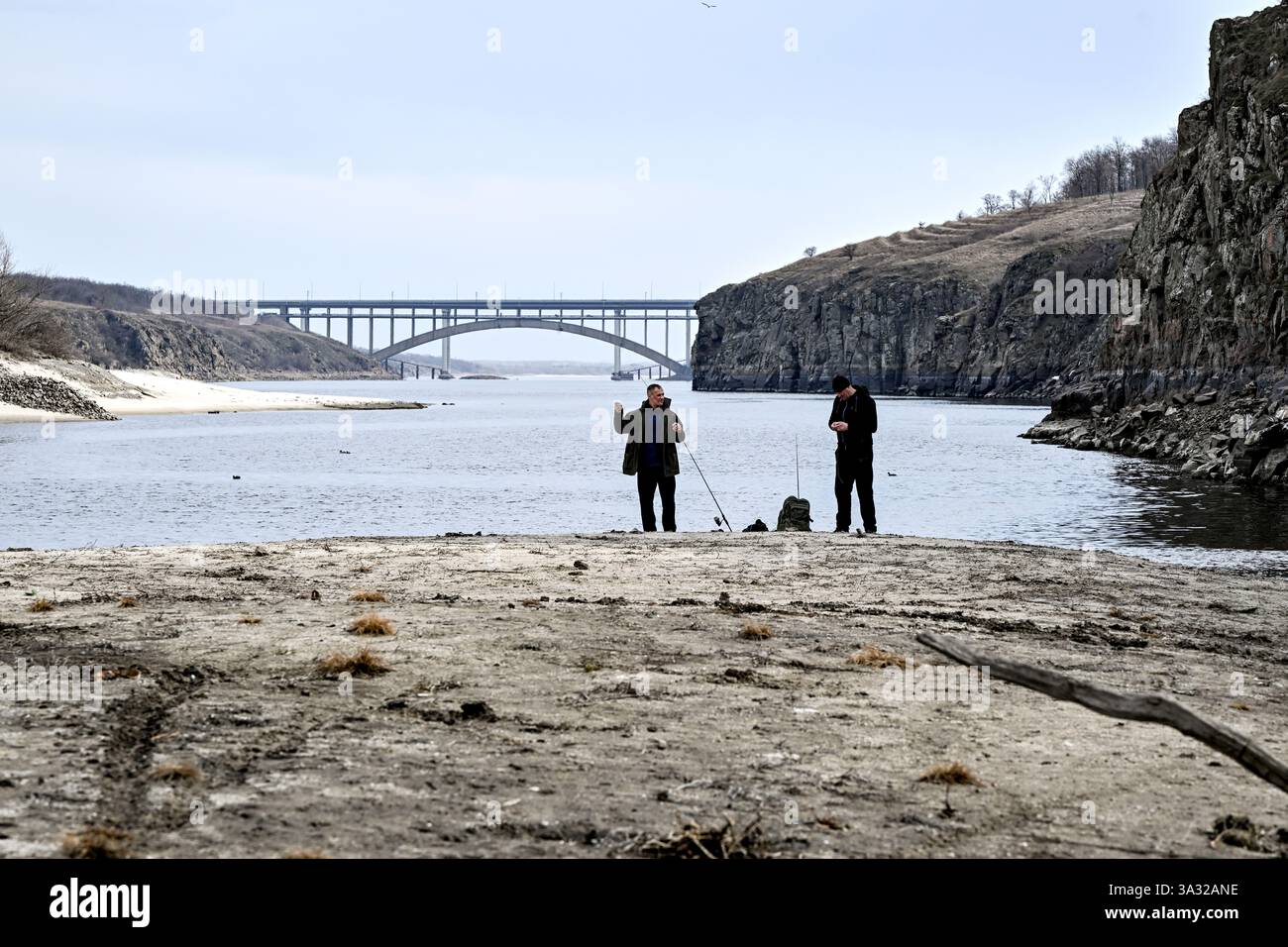 Men fish by the River Dnipro in the Vyrva tract in Zaporizhzhia ...