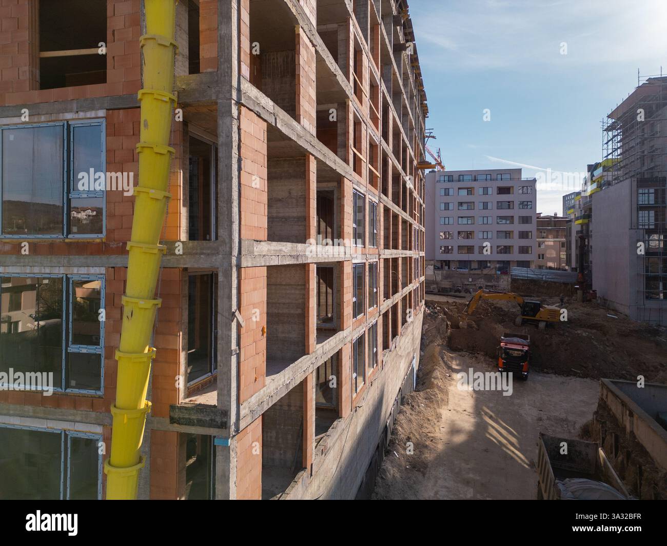 Construction site of a high-rise building at sunny day. The structure's ...