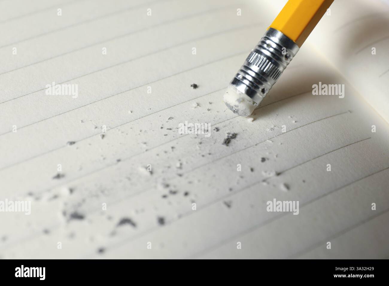 Using pencil with eraser on sheet of paper, closeup Stock Photo - Alamy