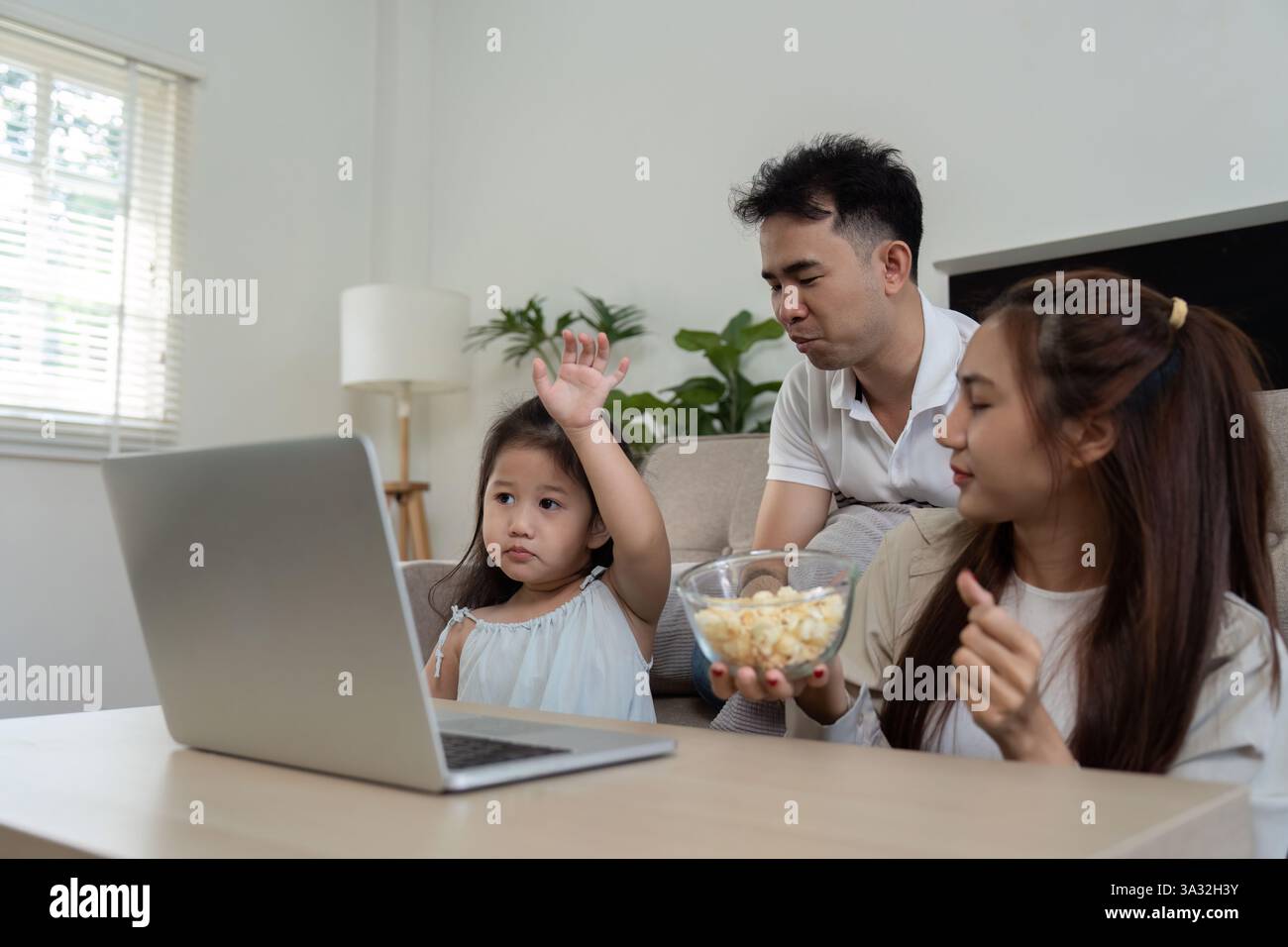 Playful Interaction and Movie Watching. A delightful family moment ...