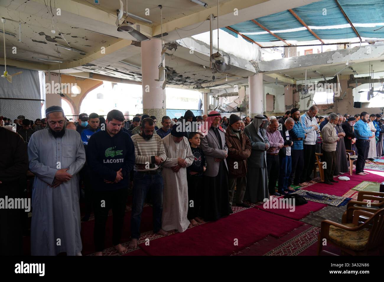 Palestinians take part in Friday prayers in the ruins of a Mosque that ...