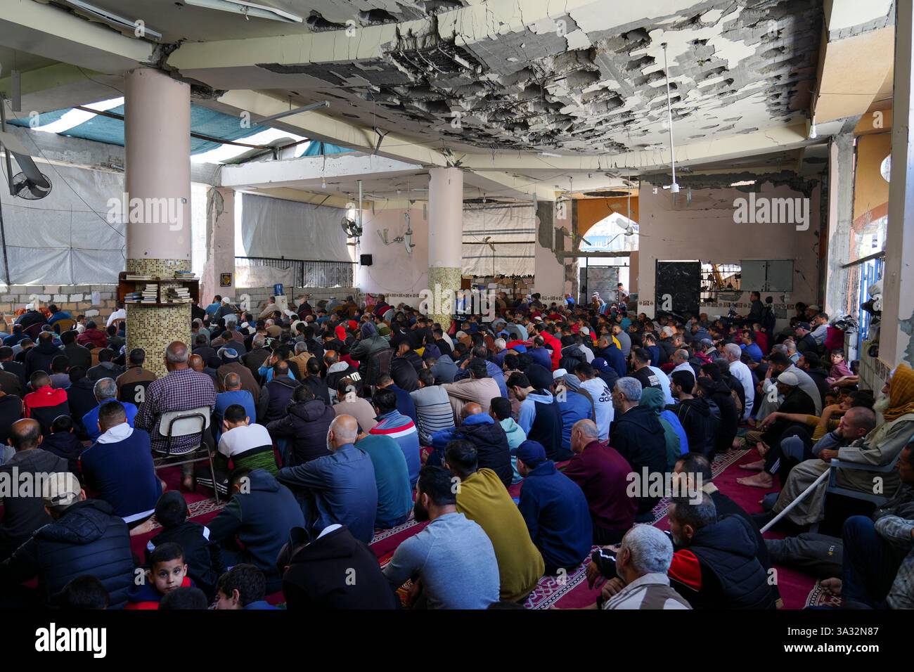 Palestinians take part in Friday prayers in the ruins of a Mosque that ...