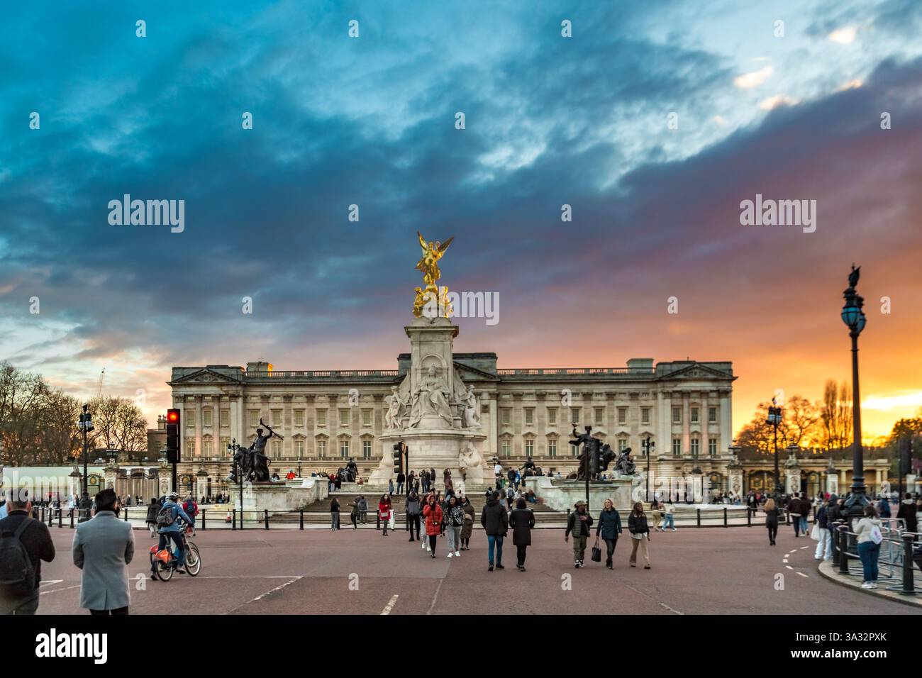 Lovely sunset view of people walking around the famous Victoria ...