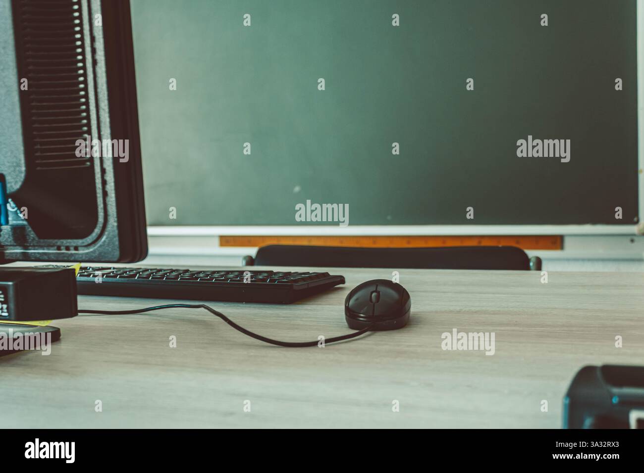 Computer Desk with Keyboard and Mouse in Classroom Stock Photo - Alamy
