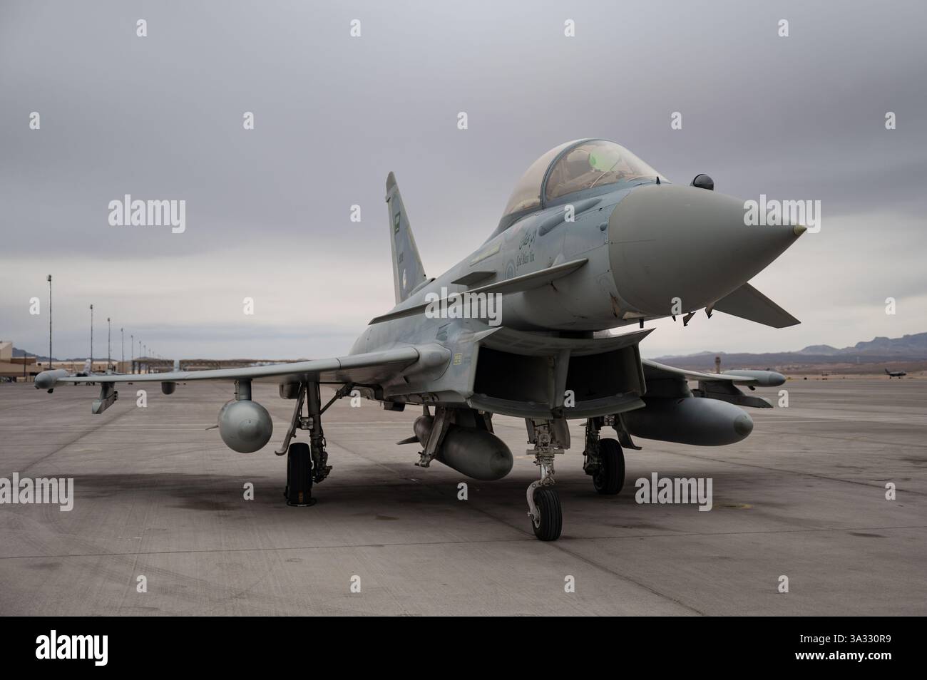 A Royal Saudi Air Force Eurofighter Typhoon sits on the flightline in ...