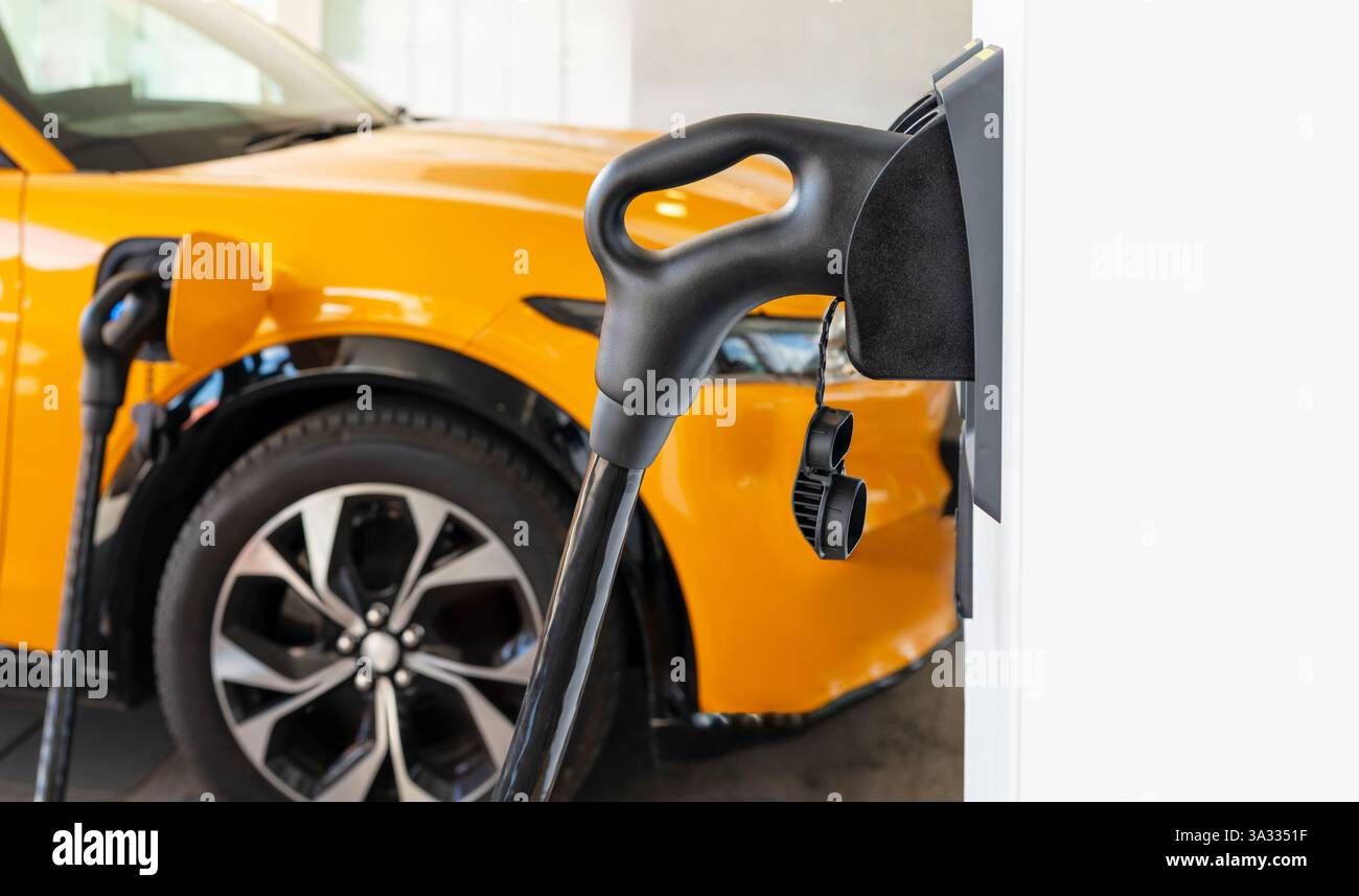Closeup photo of EV charging plug. Electric car charging station Stock ...