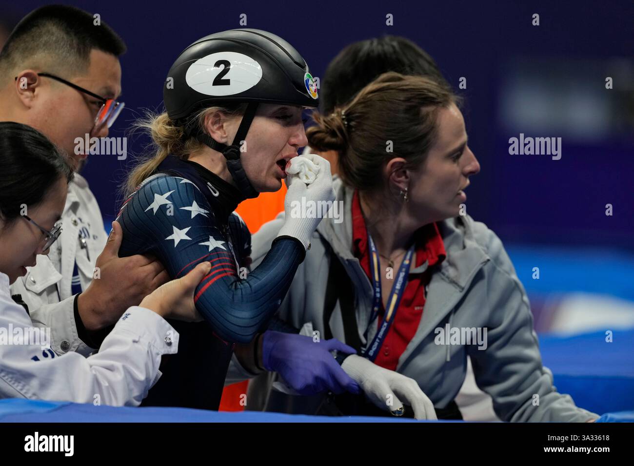 Team United State's Kristen Santos-Grisworld holds a cotton swab to her ...