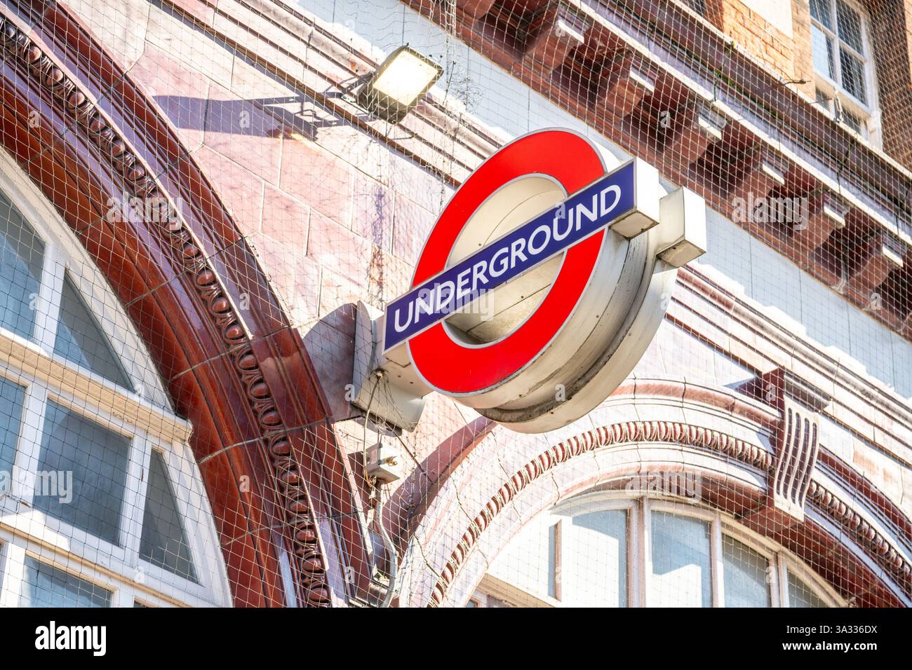 A prominent Underground sign stands out against the architectural ...
