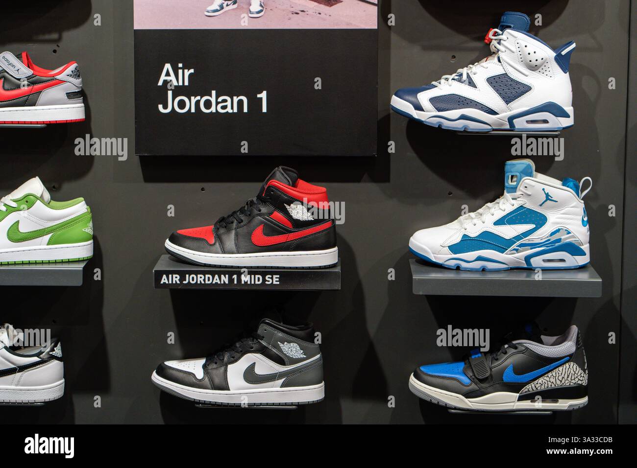 Nike Air Jordan shoes display in the interior of a sports shoe store ...