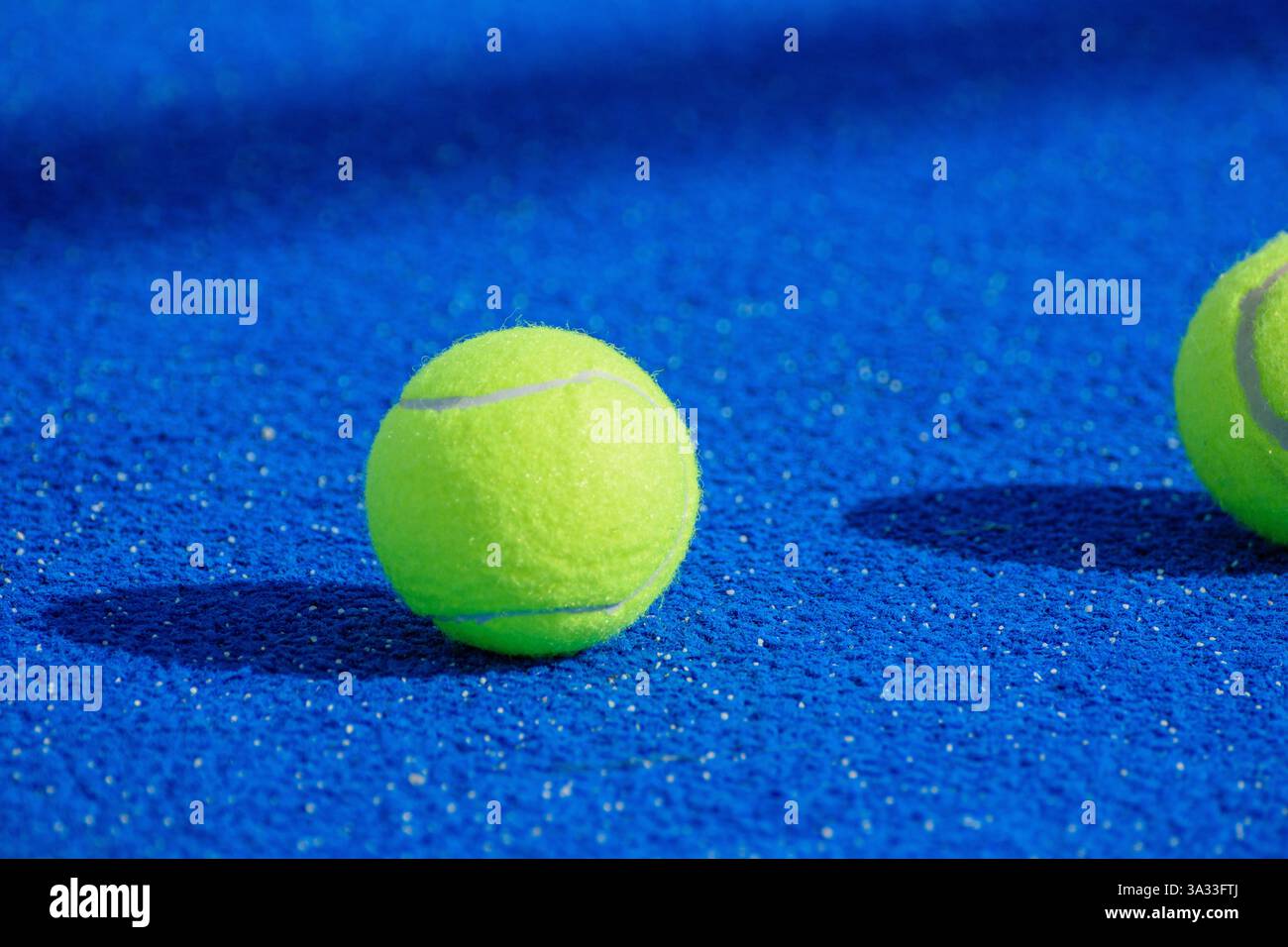 lonely ball in a paddle tennis court, racket sport background concept ...