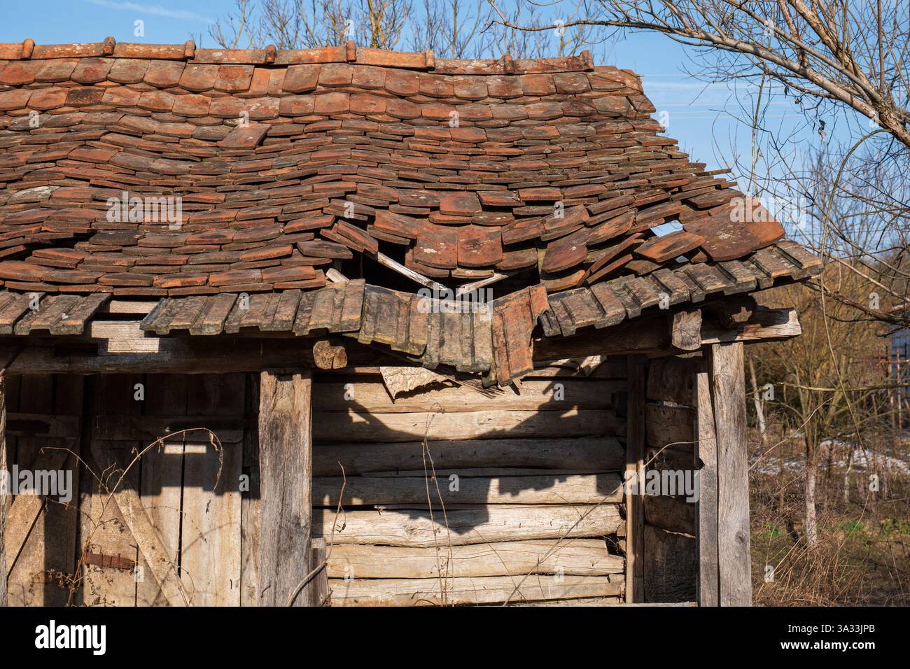 Old, worn-down, collapsing roof tiles on an abandoned countryside house, no people Stock Photo ...