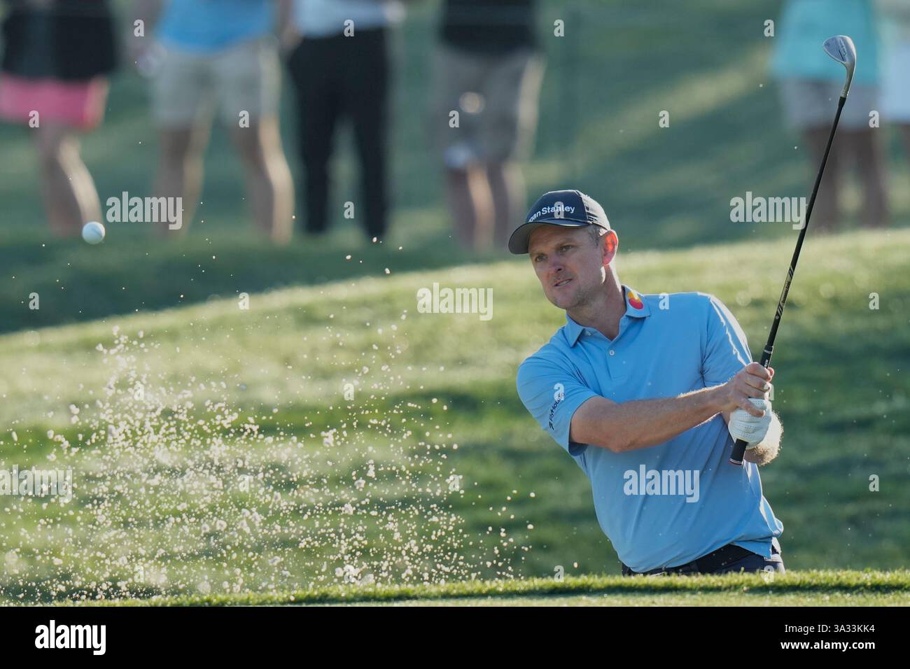 Justin Rose hits out of a bunker on the 11th hole during the second ...