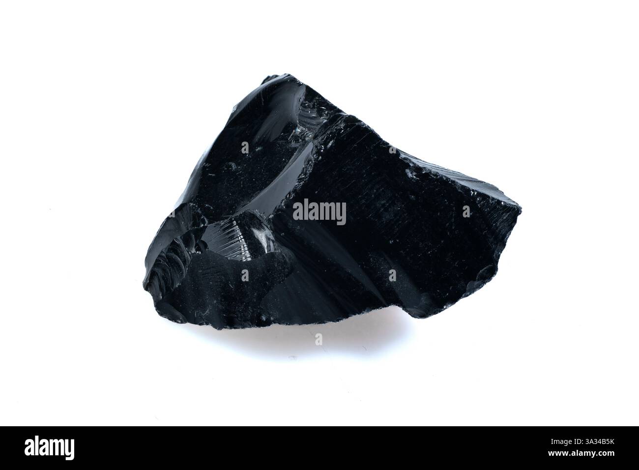 Natural form of raw black obsidian volcanic rock isolated on white ...
