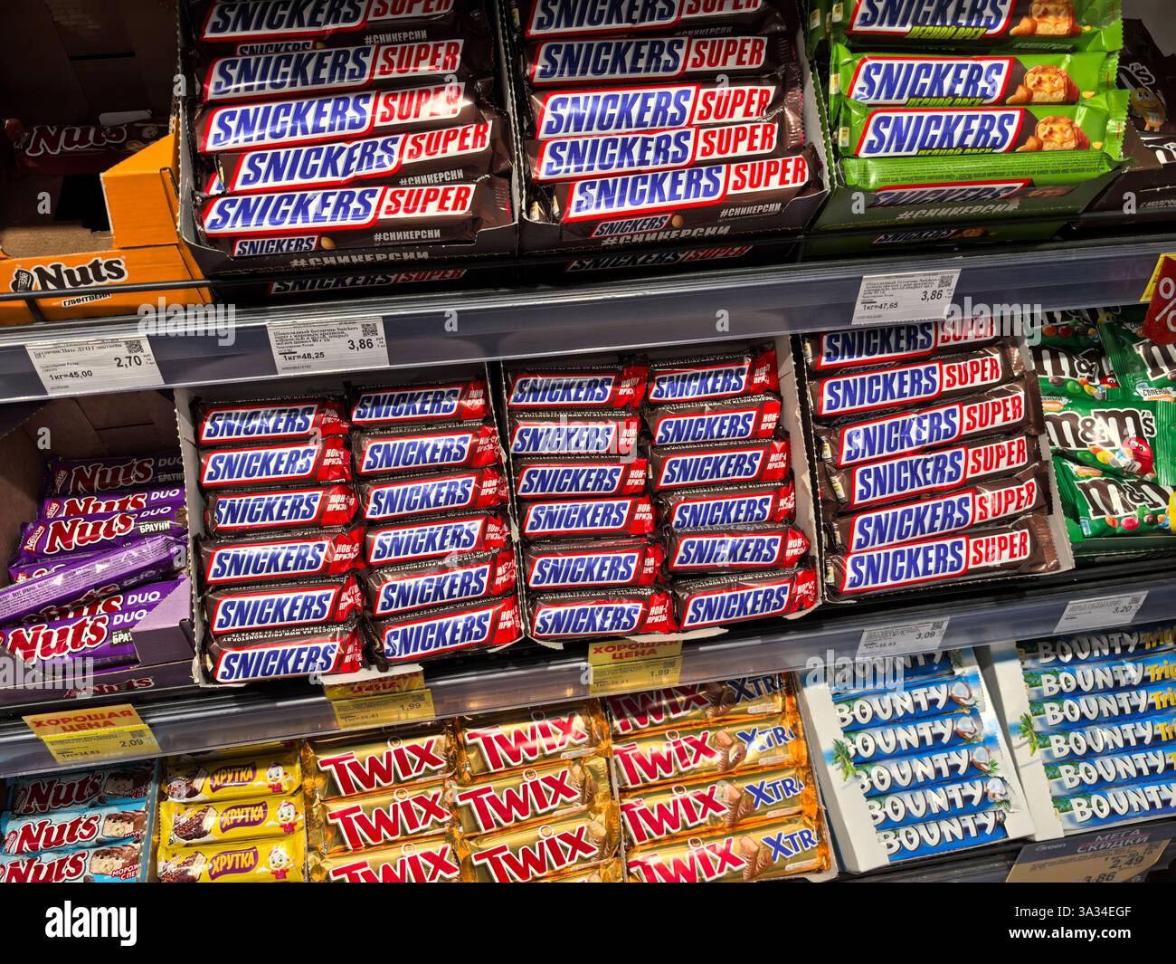 Bobruisk, Belarus - March 2, 2025: Rows of colorful chocolate bars line ...