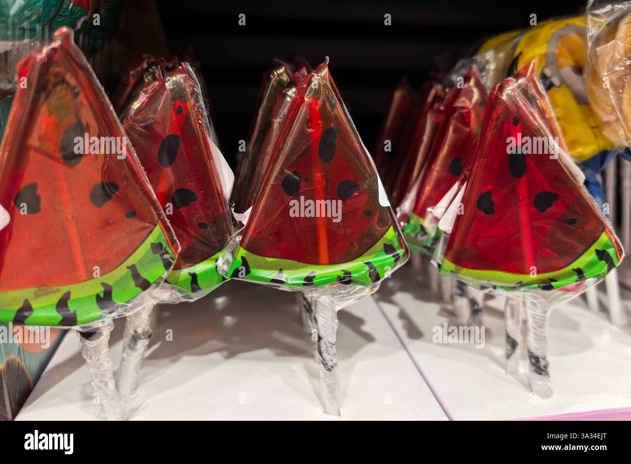 Vibrant watermelon-shaped lollipops with colorful details brighten the ...