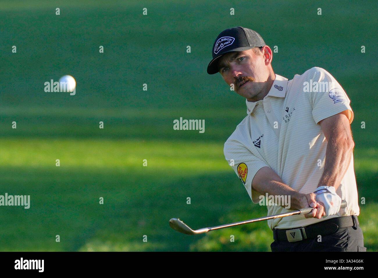 Chandler Phillips chips onto the second green during the second round ...