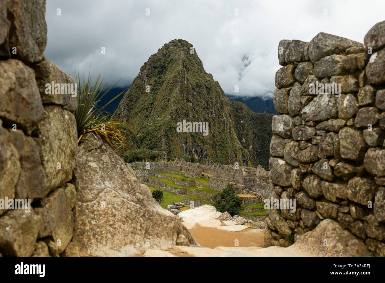 A unique perspective of Machu Picchu, featuring a view through Inca ...