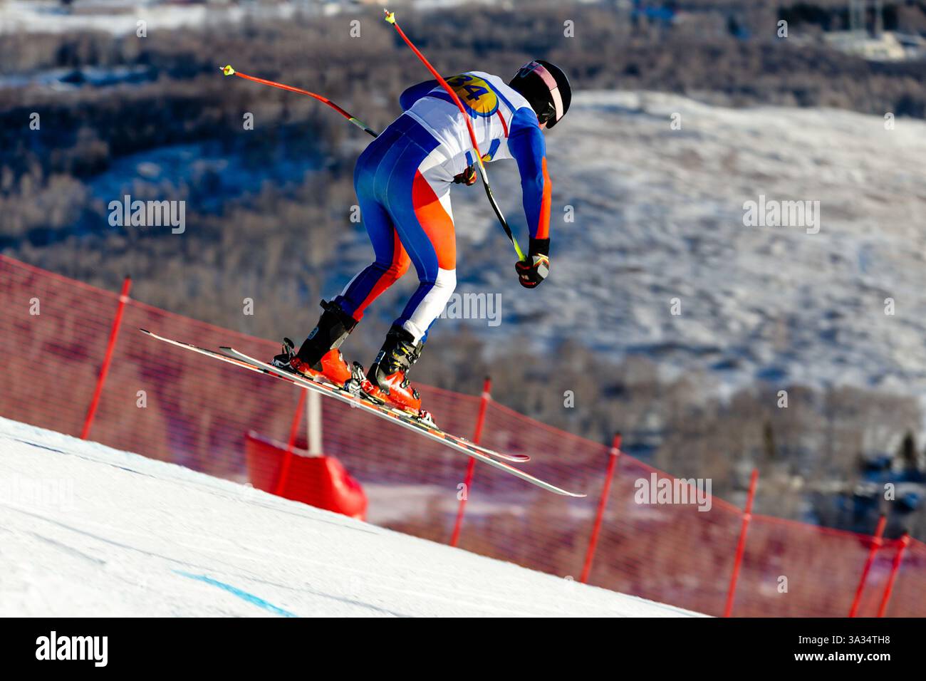 ski racer soars through air during competitive downhill skiing Stock ...